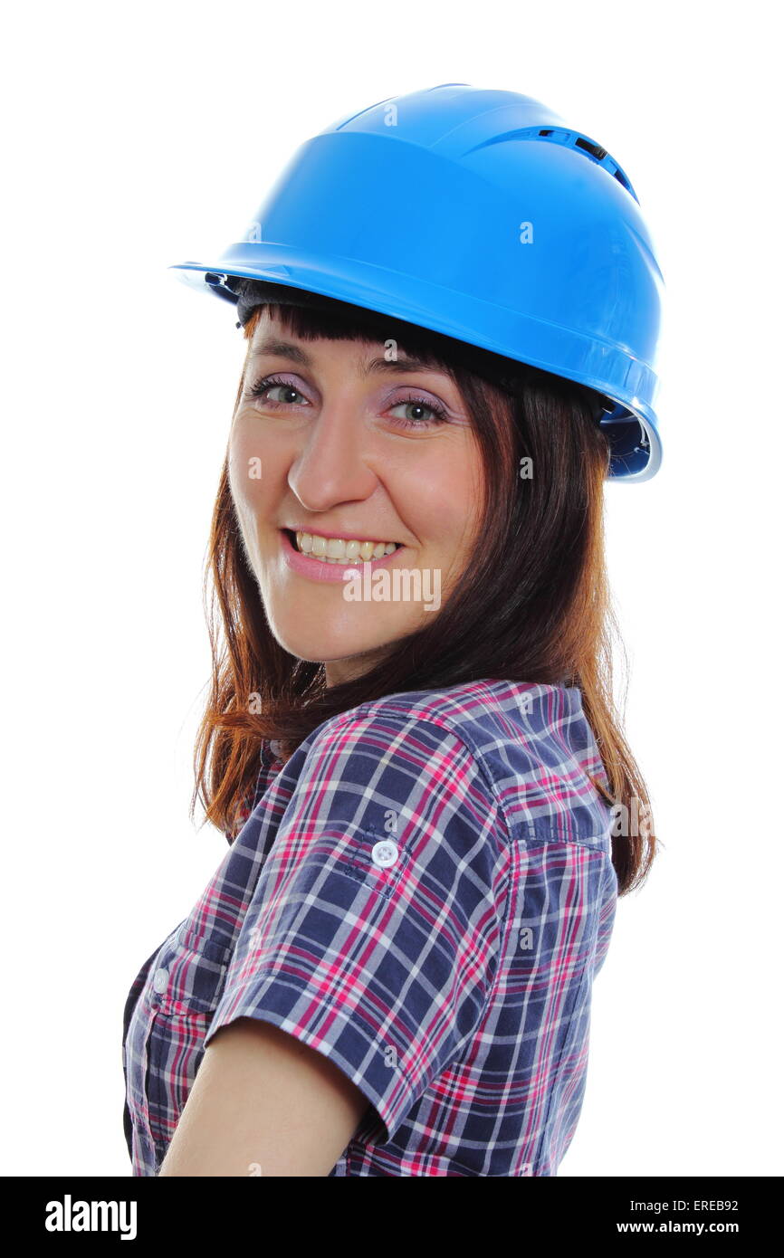 Smiling female construction worker wearing protective blue helmet, industrial worker woman ...