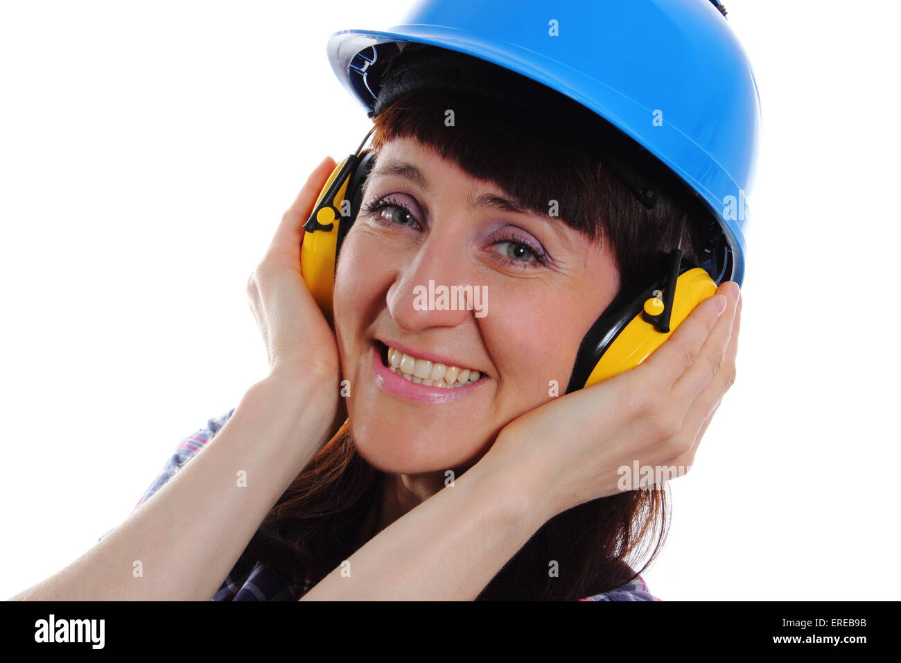 Female construction worker wearing blue helmet and protective ...