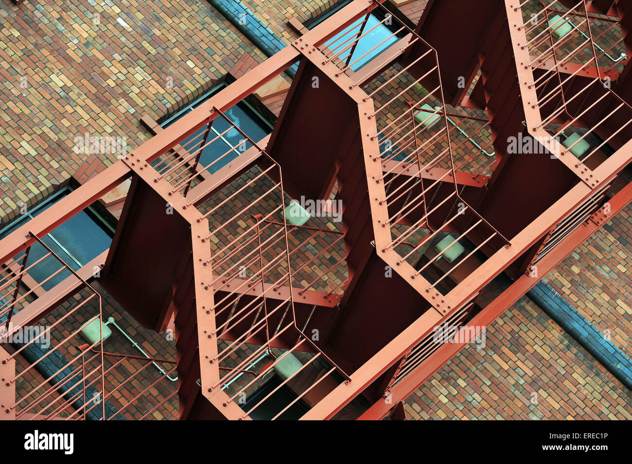 A red painted metal exterior fire escape on a building in Bristol Stock ...
