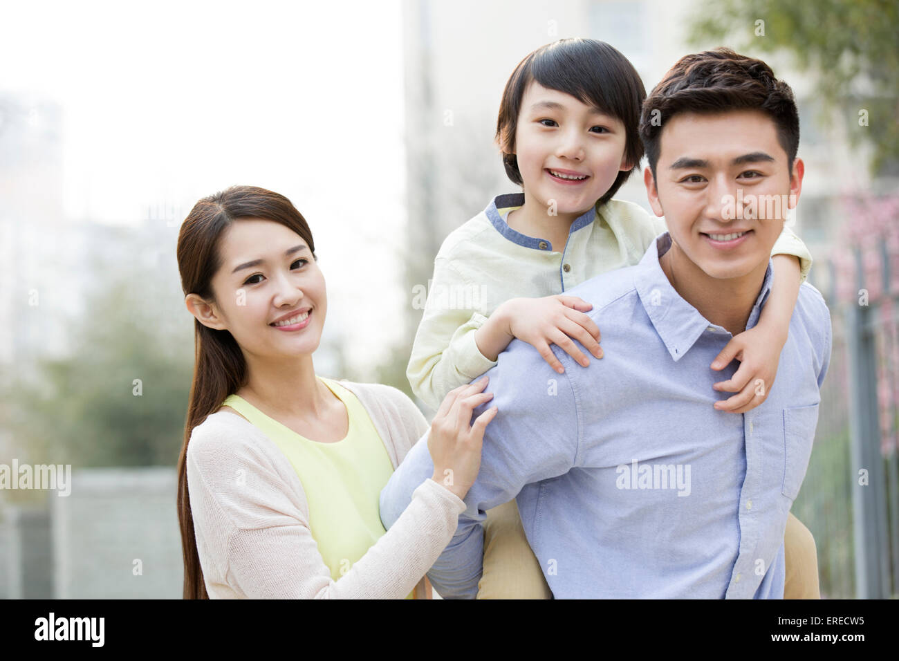 Happy young family Stock Photo - Alamy