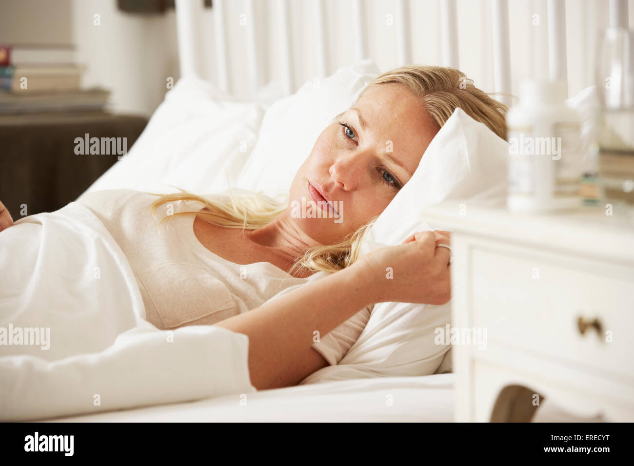Medication On Bedside Table Of Sleepless Woman Stock Photo - Alamy
