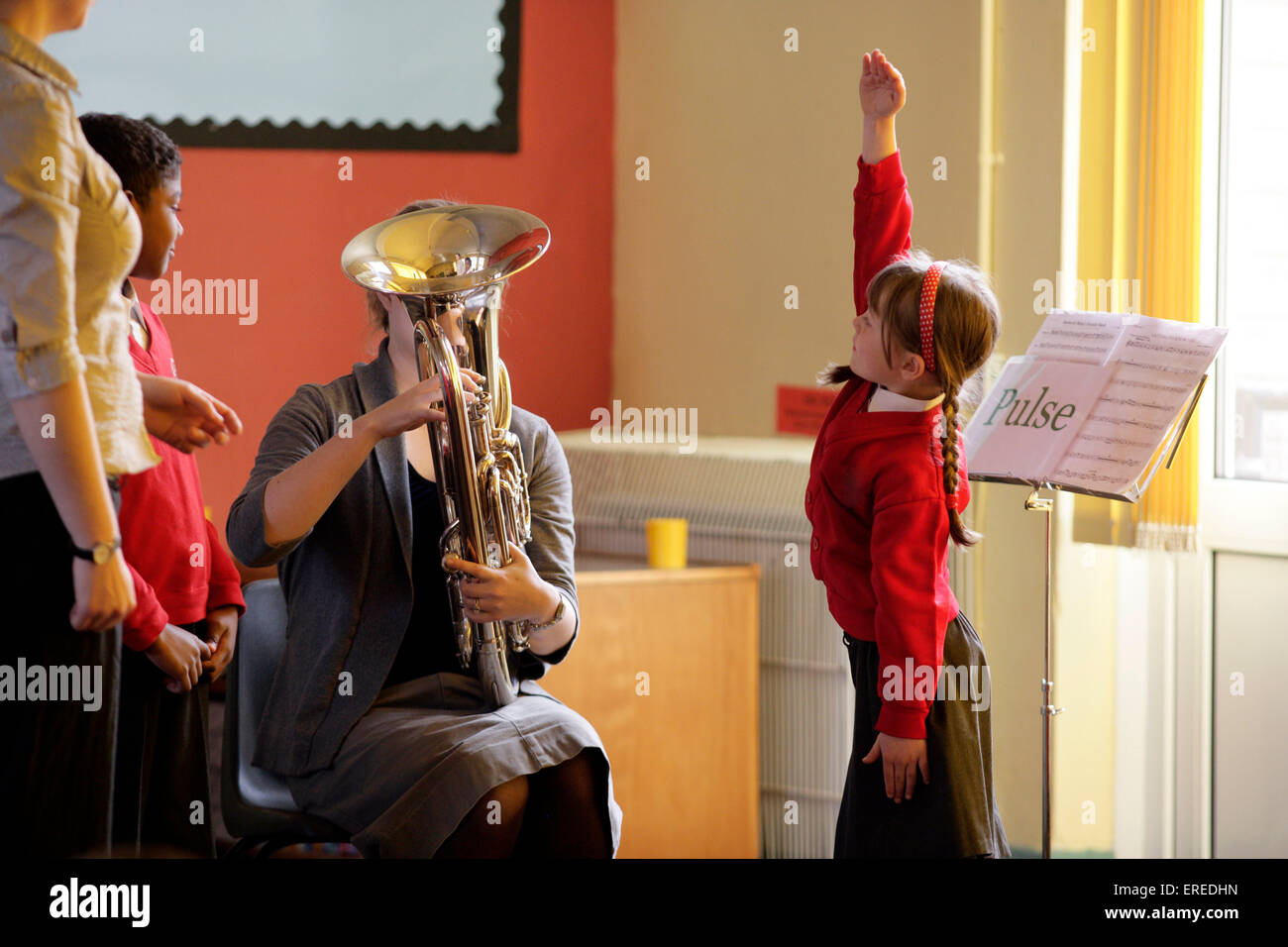 Music workshop leaders playing a musical game in a classroom Stock ...