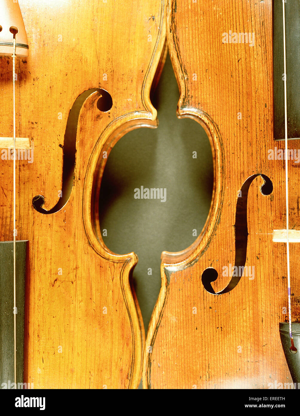 INSTRUMENTS - STRING - VIOLIN Two violins on dark background, showing f ...
