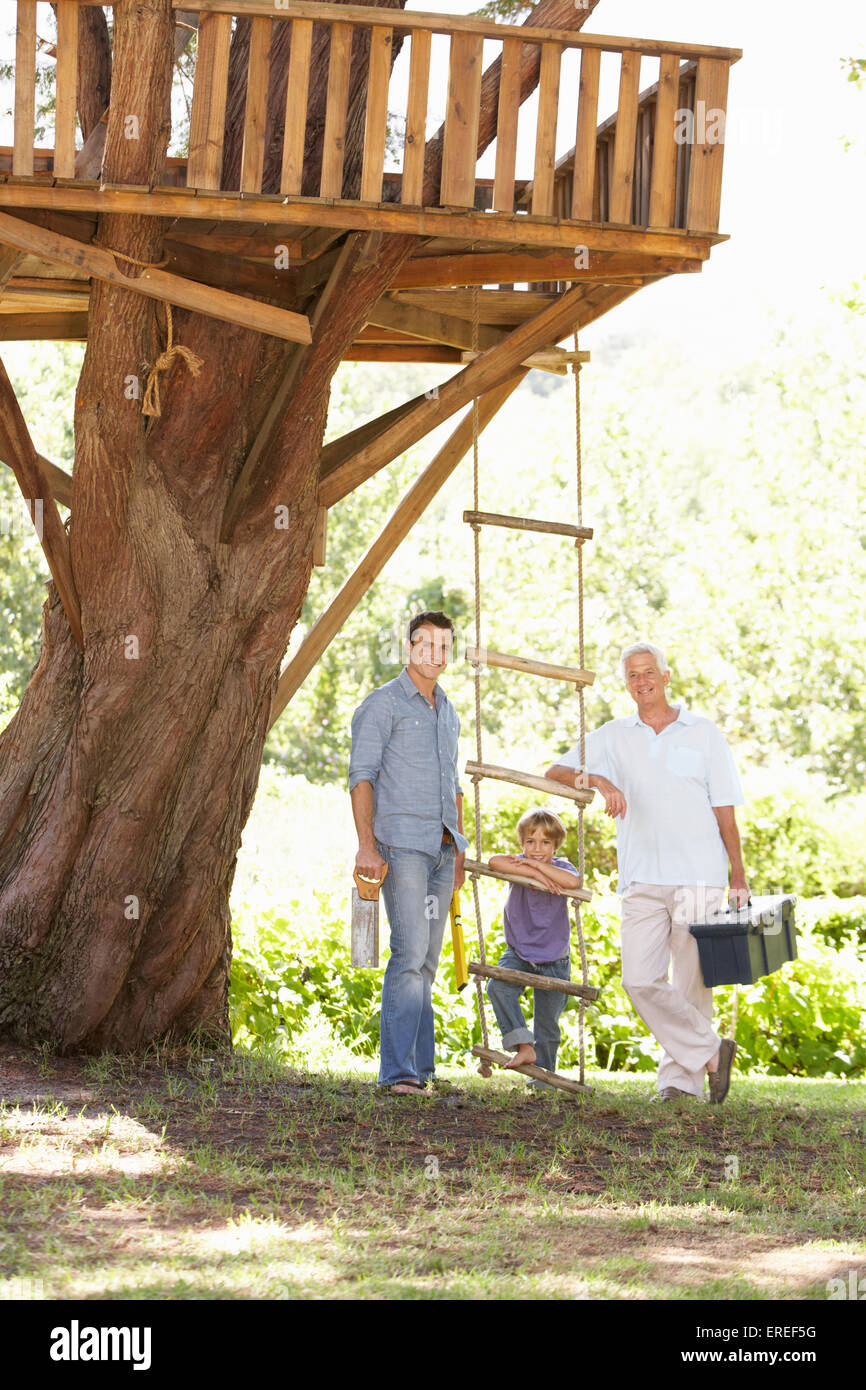 Grandfather, Father And Son Building Tree House Together Stock Photo ...