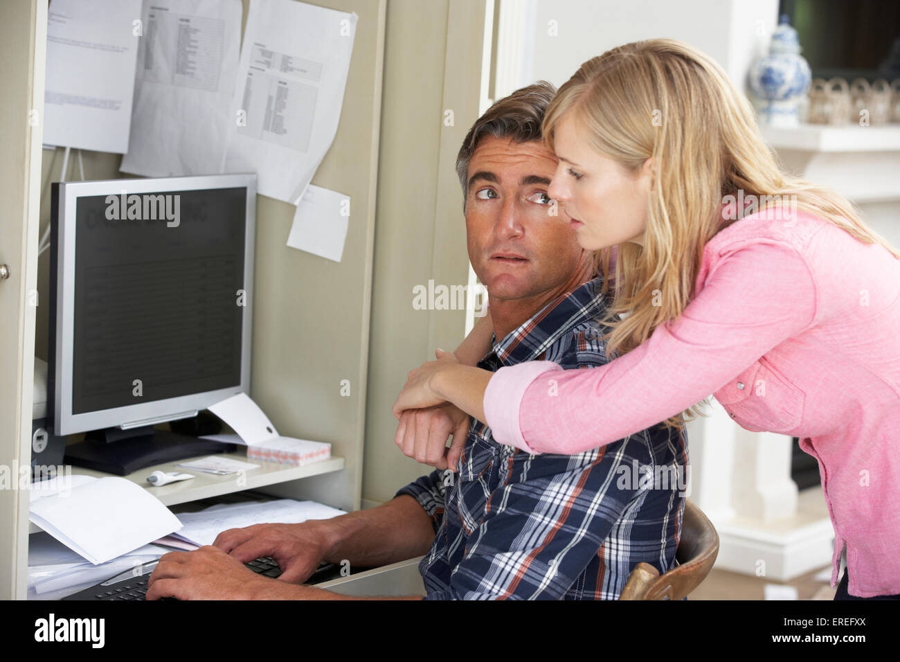 Concerned Couple In Home Office Stock Photo - Alamy