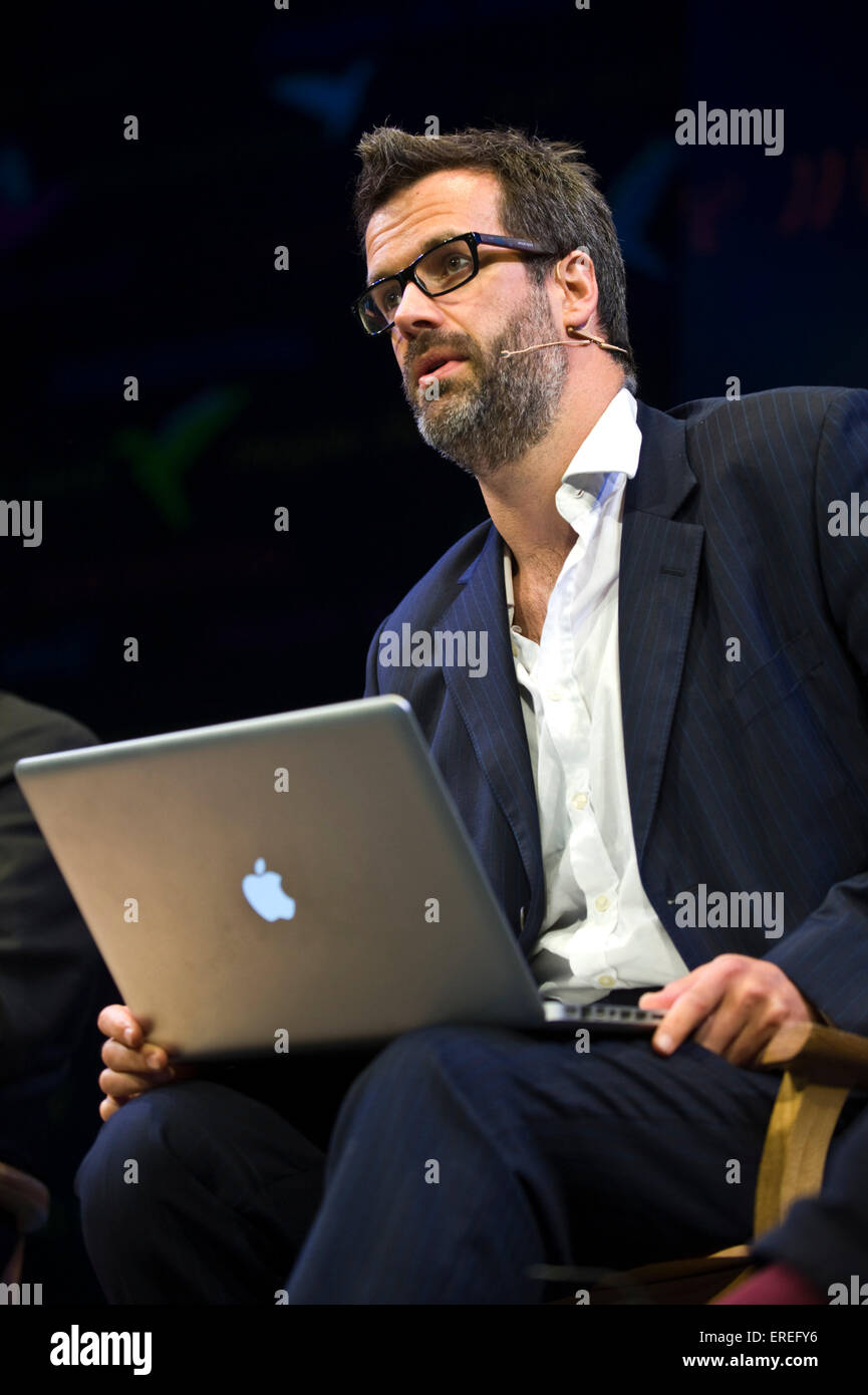 Marcus Brigstocke comedian on stage with MacBook at Hay Festival 2015 ...