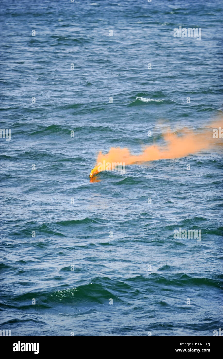 Orange smoke comes out from a flare fired during a safety demonstration ...