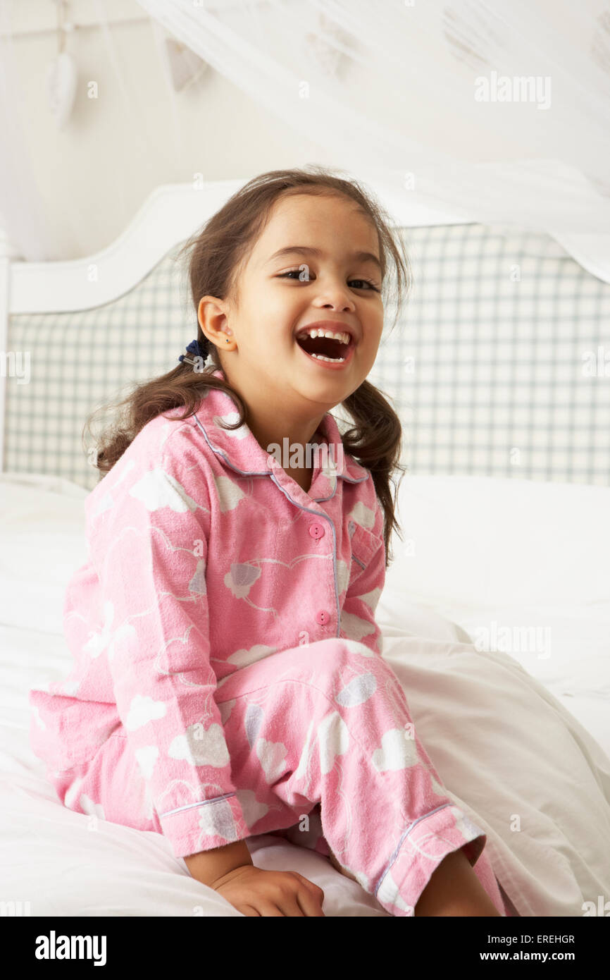 Young Girl Wearing Pajamas Sitting On Bed Stock Photo - Alamy Young Girl Wearing Pajamas Sitting On Bed Stock Photo - Alamy