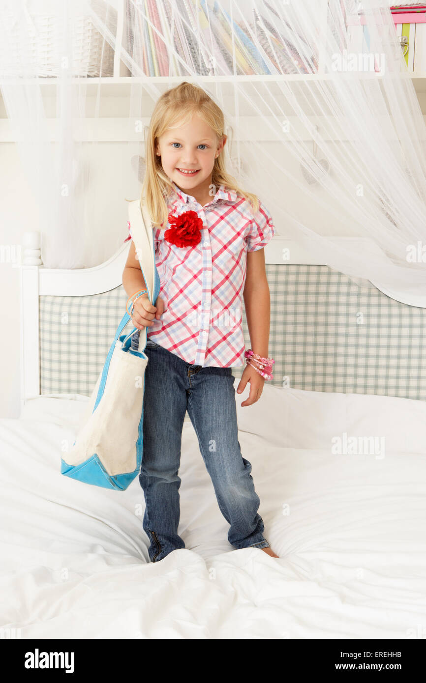 Young Girl Dressing Up In Bedroom Stock Photo - Alamy