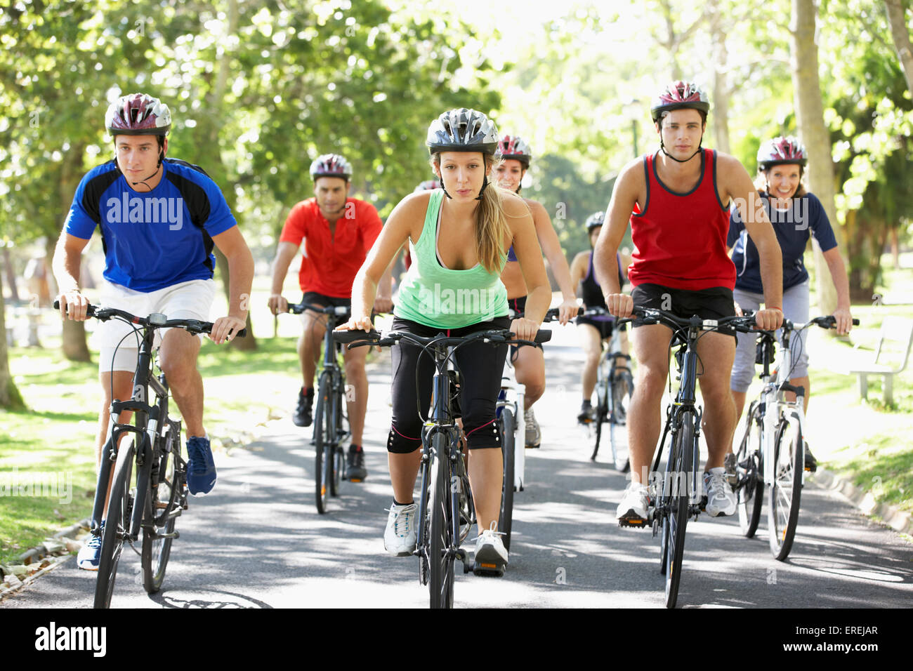 Group Of Cyclists On Cycle Ride Through Park Stock Photo - Alamy