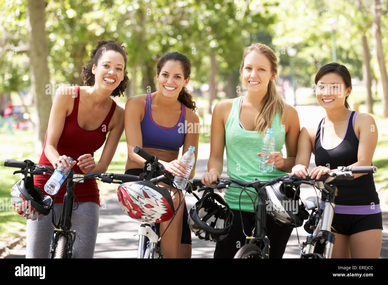 Group Of Women Resting During Cycle Ride Through Park Stock Photo - Alamy