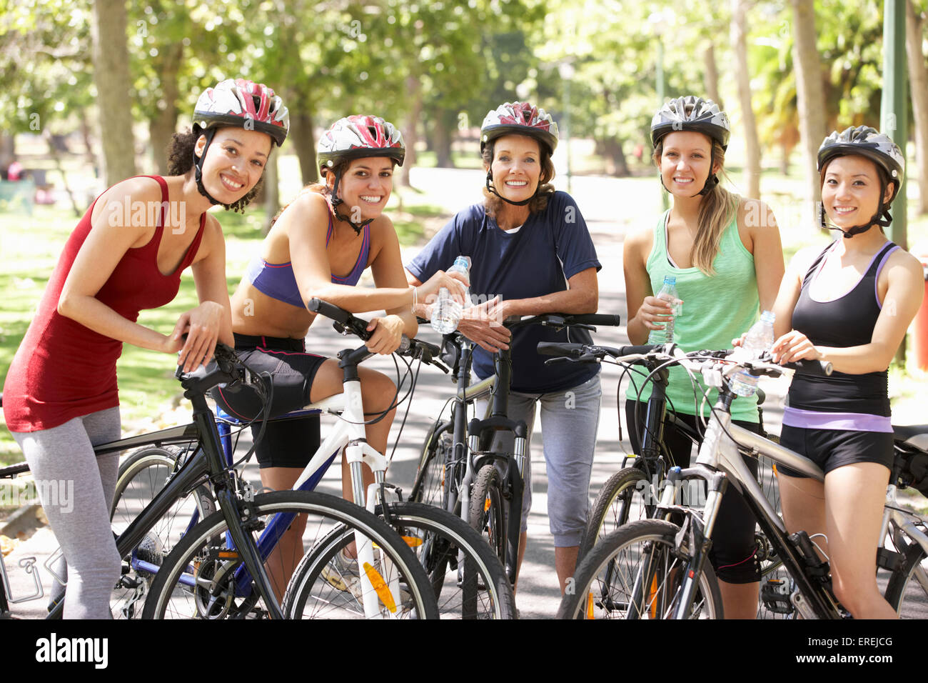 Group Of Women Resting During Cycle Ride Through Park Stock Photo - Alamy