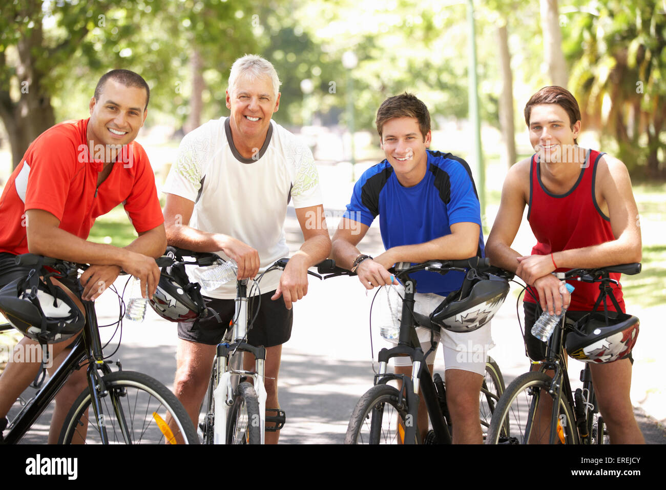 Group Of Men Resting During Cycle Ride Through Park Stock Photo - Alamy