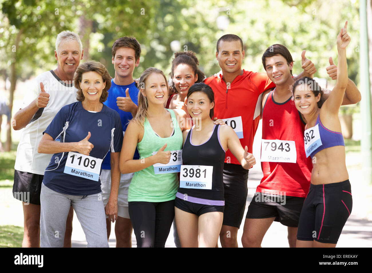 Group Of Runners Jogging Through Park Stock Photo - Alamy