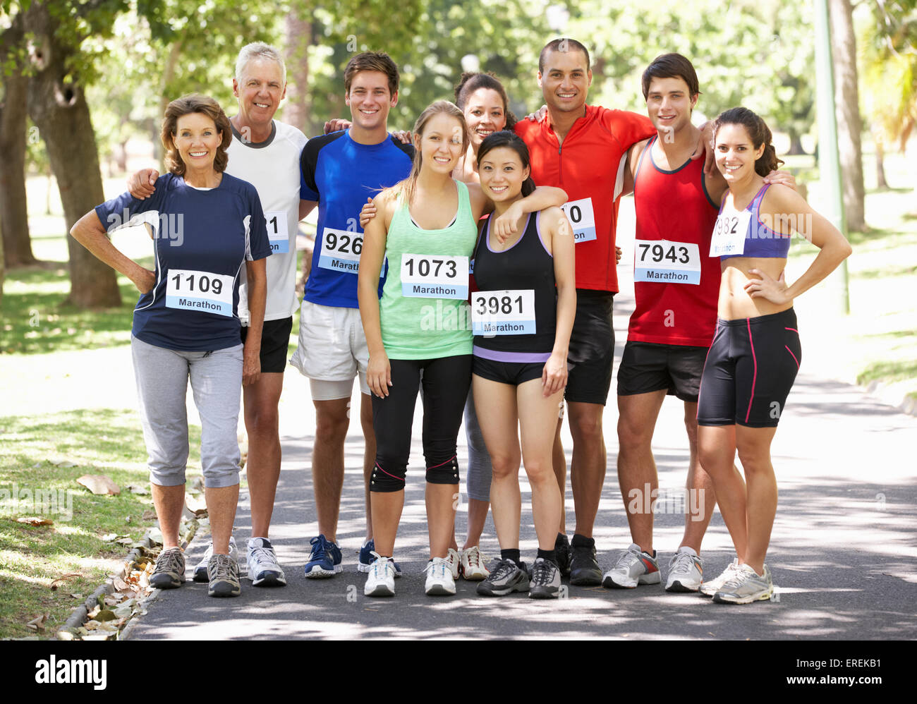 Group Of Runners Jogging Through Park Stock Photo - Alamy