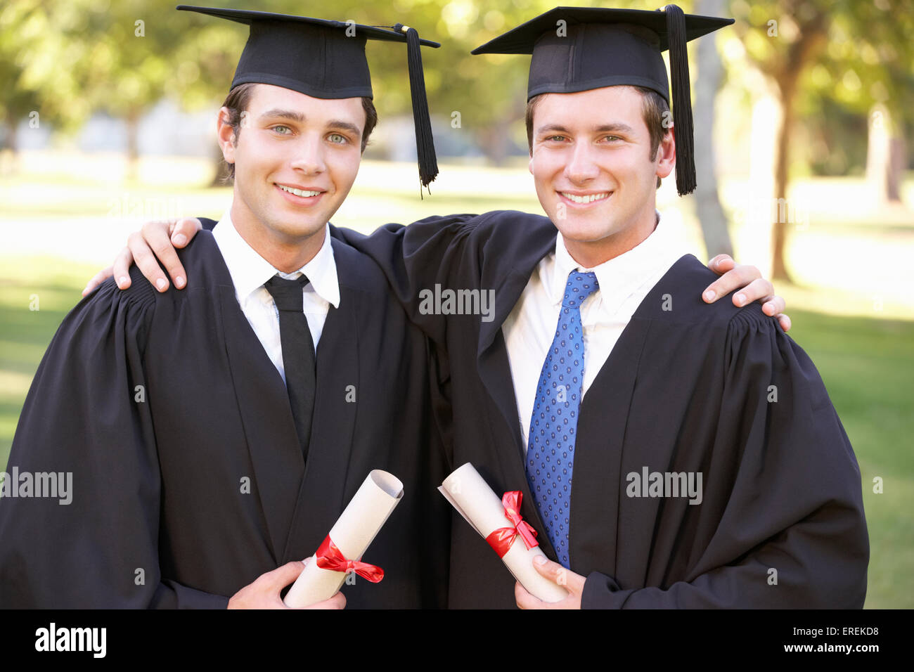 Two Male Students Attending Graduation Ceremony Stock Photo - Alamy