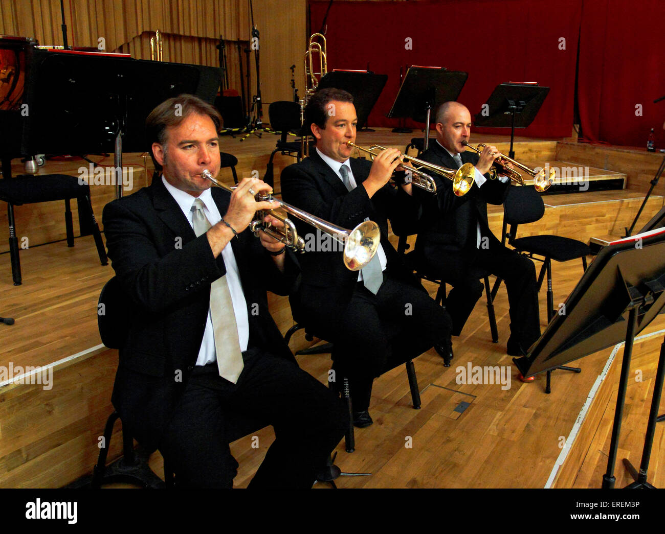 Orchestral Trumpet section, three players holding their trumpets Stock ...