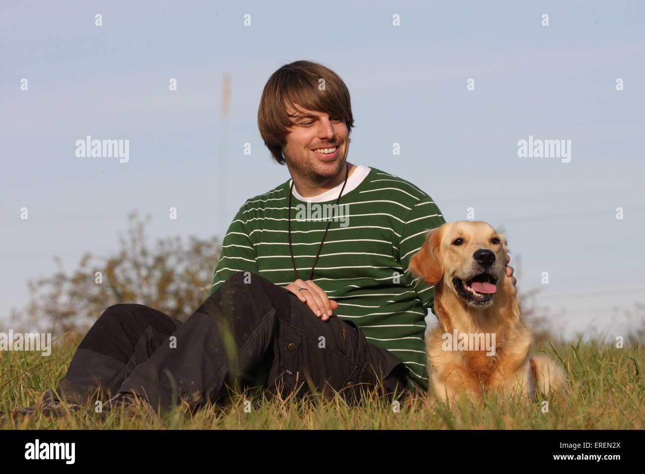 man and Golden Retriever Stock Photo - Alamy