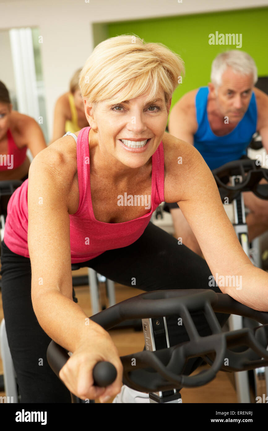 Woman Taking Part In Spinning Class In Gym Stock Photo - Alamy