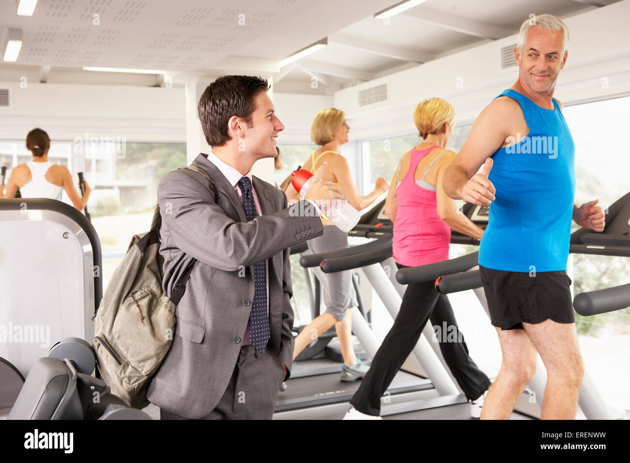 Businessman Arriving At Gym After Work Stock Photo - Alamy
