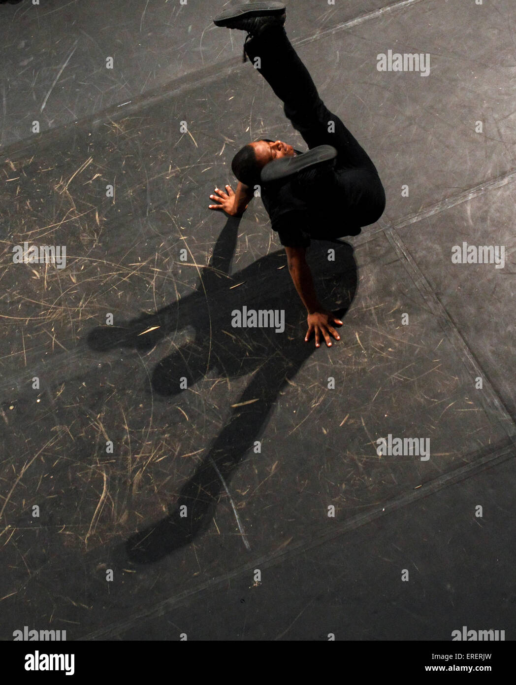 Boy taking part in a streetdance demonstration, Double handed jump ...
