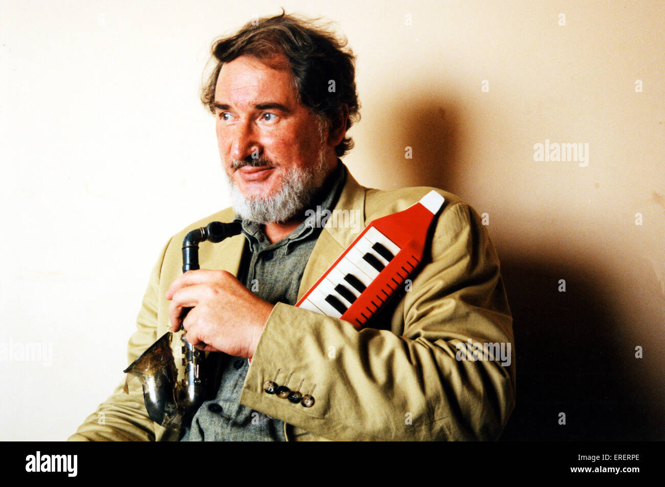 Heinz Carl Gruber in 1998 holding toy instruments. Austrian Composer, b ...