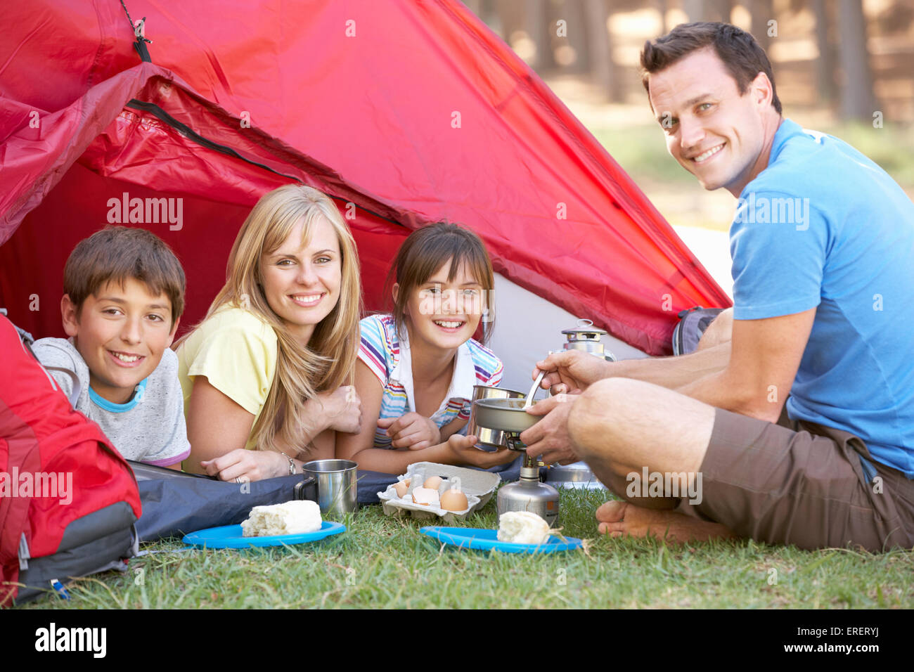 Family Cooking Breakfast On Camping Holiday Stock Photo - Alamy