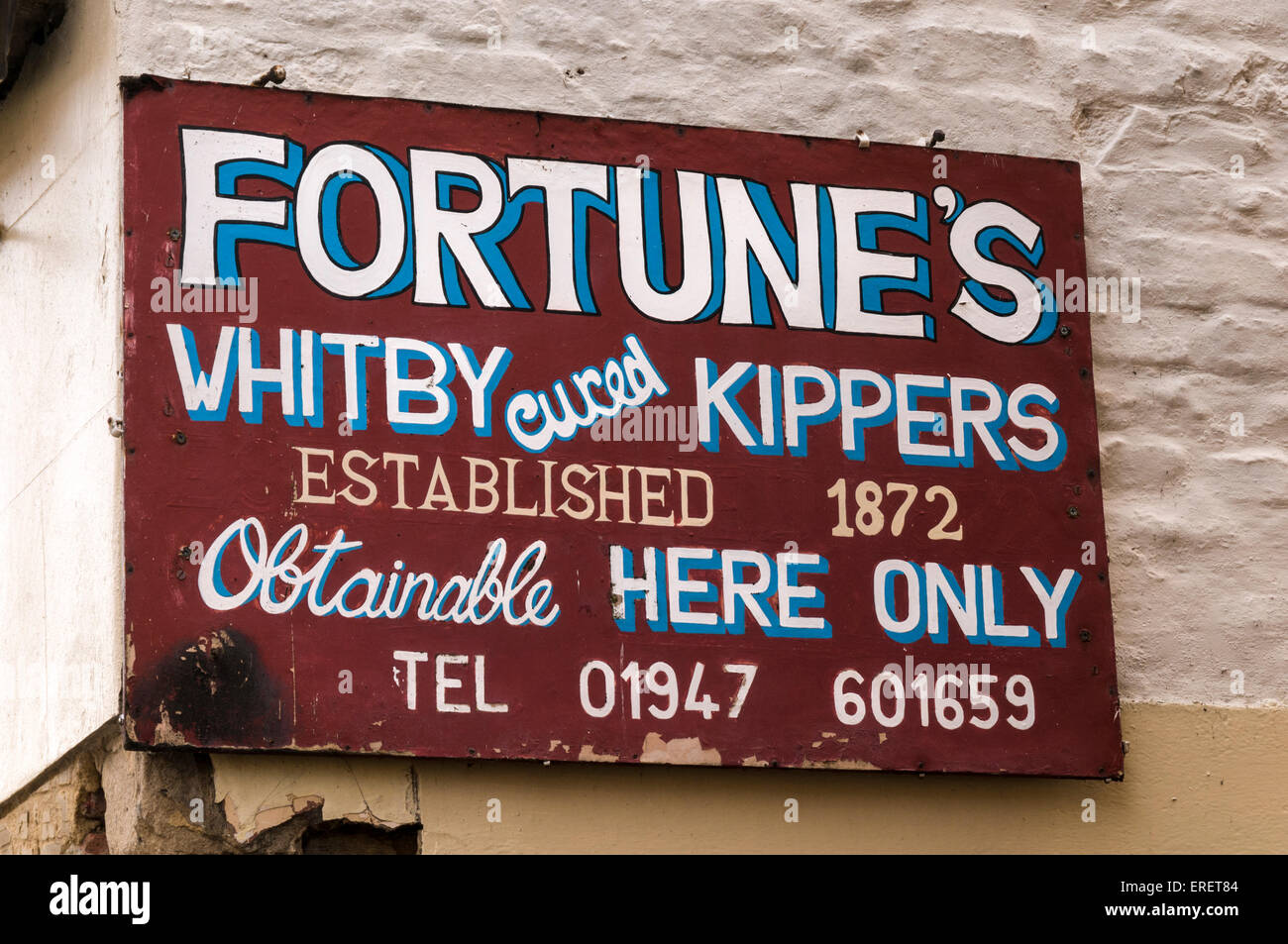 Old wooden sign for Fortune's cured Whitby kippers outside the shop ...