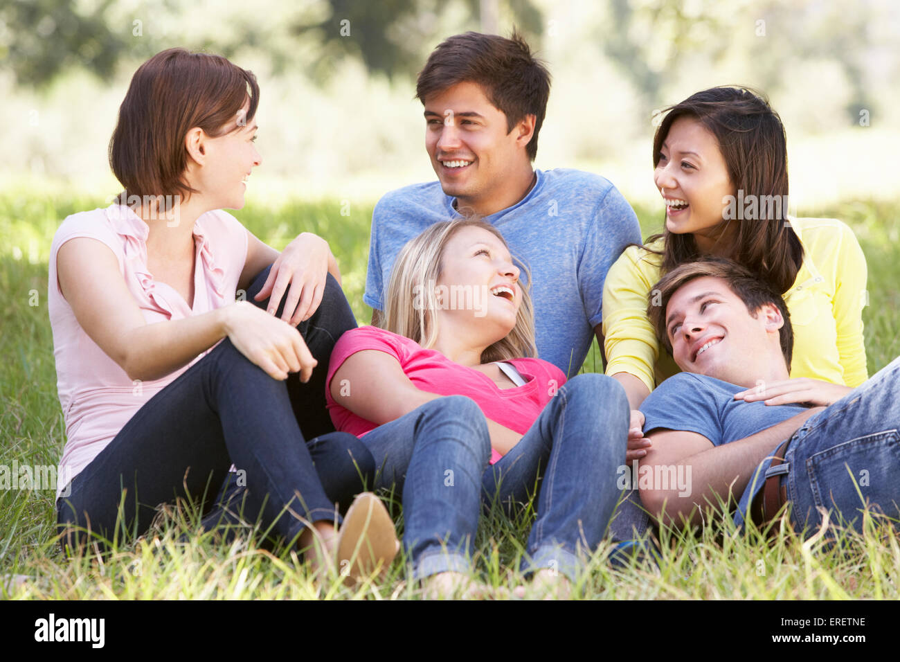 Group Of Young Friends Relaxing In Countryside Stock Photo - Alamy