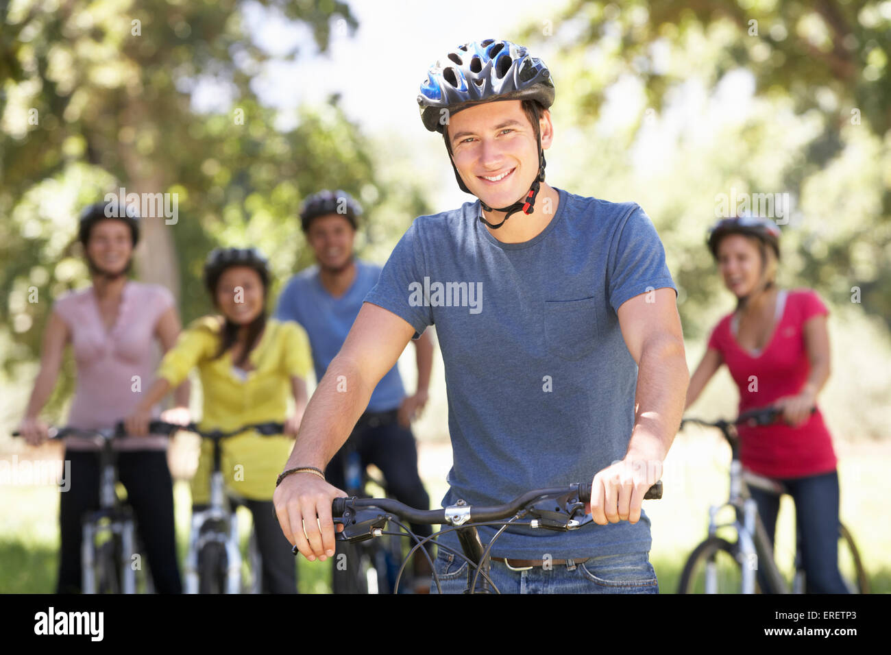 Group Of Young Friends On Cycle Ride In Countryside Stock Photo - Alamy