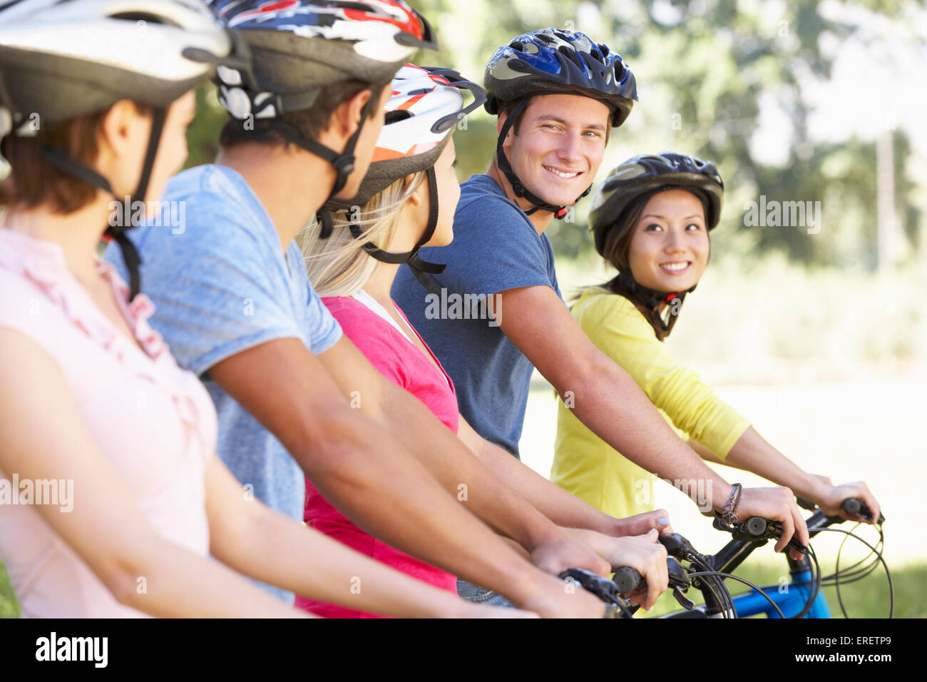 Group Of Young Friends On Cycle Ride In Countryside Stock Photo - Alamy