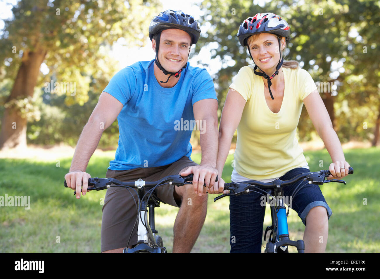 Couple On Cycle Ride In Countryside Stock Photo - Alamy