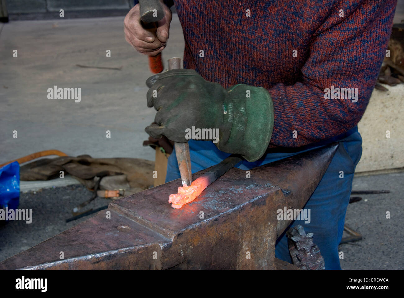 Close-up of blacksmith's hands demonstrating this traditional skill in ...