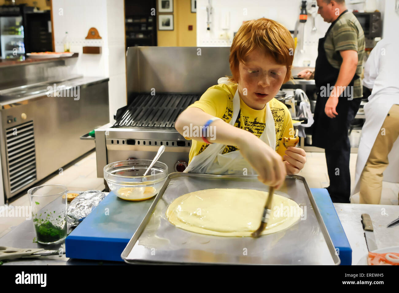 Boys having a cooking lesson in a traditional members only Basque ...