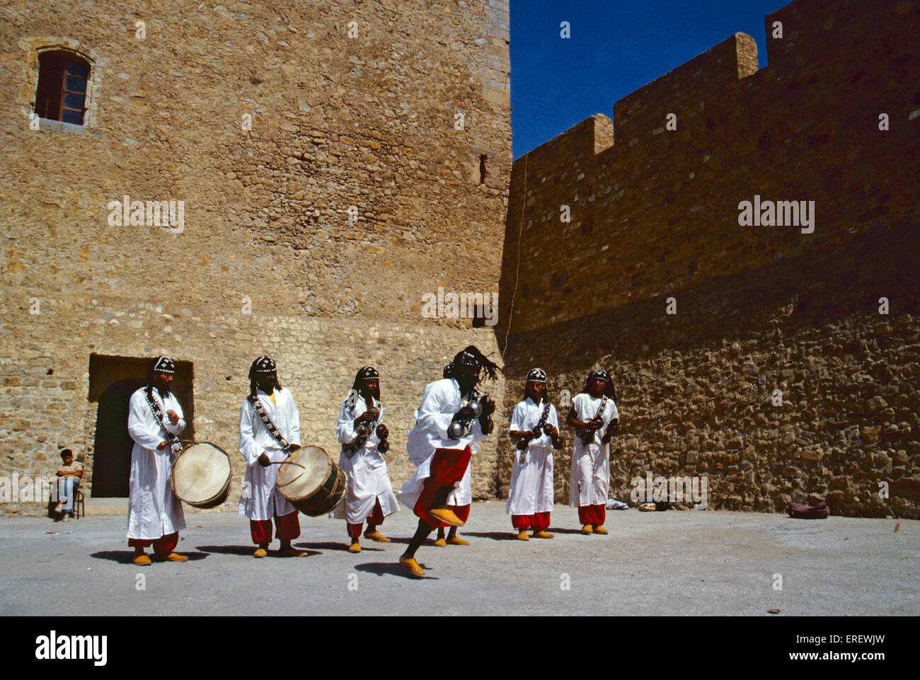 Moroccan Gnawa musicians and dancers playing qraqeb (metal castanets ...