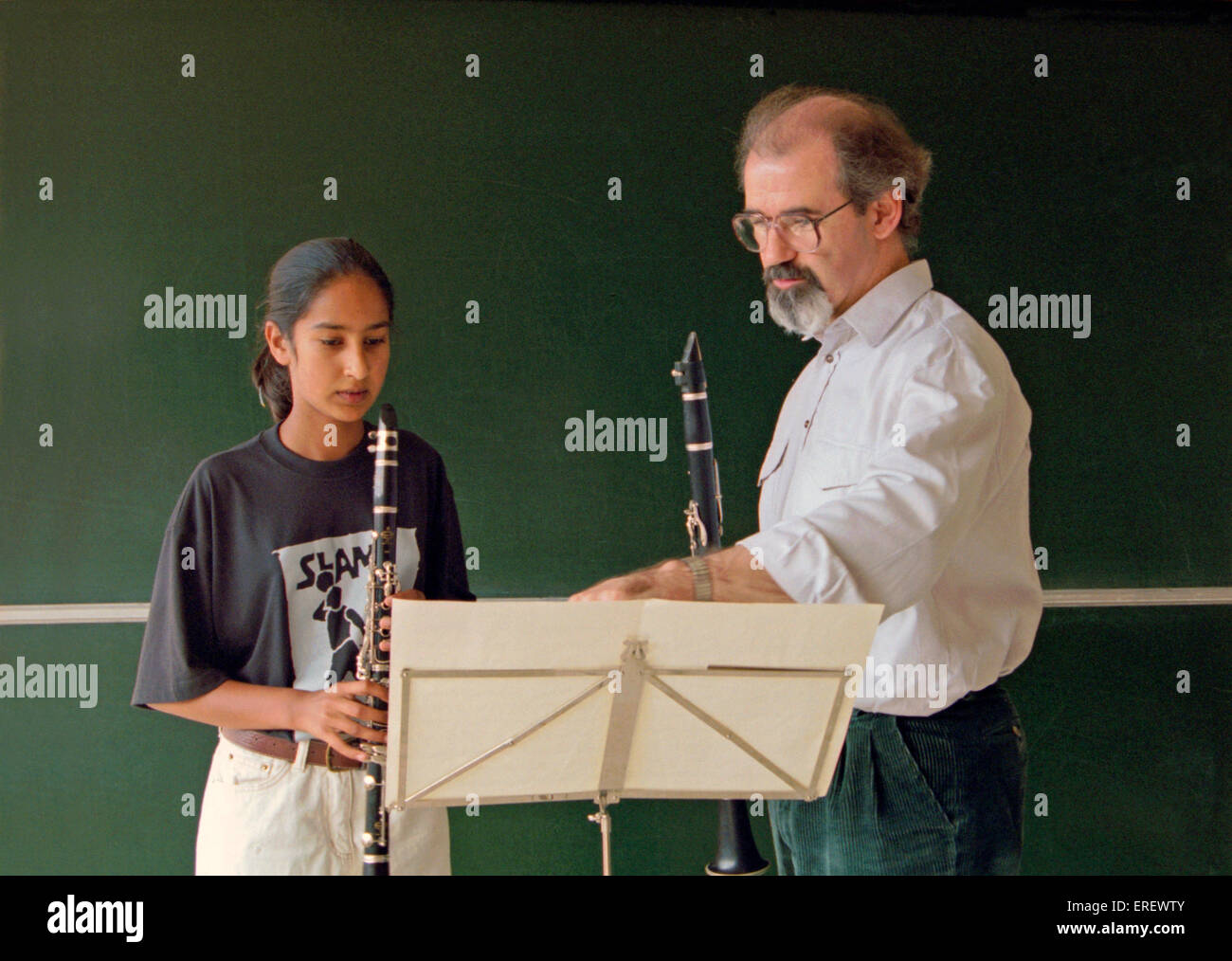 Male clarinet teacher with teenage female student Stock Photo - Alamy