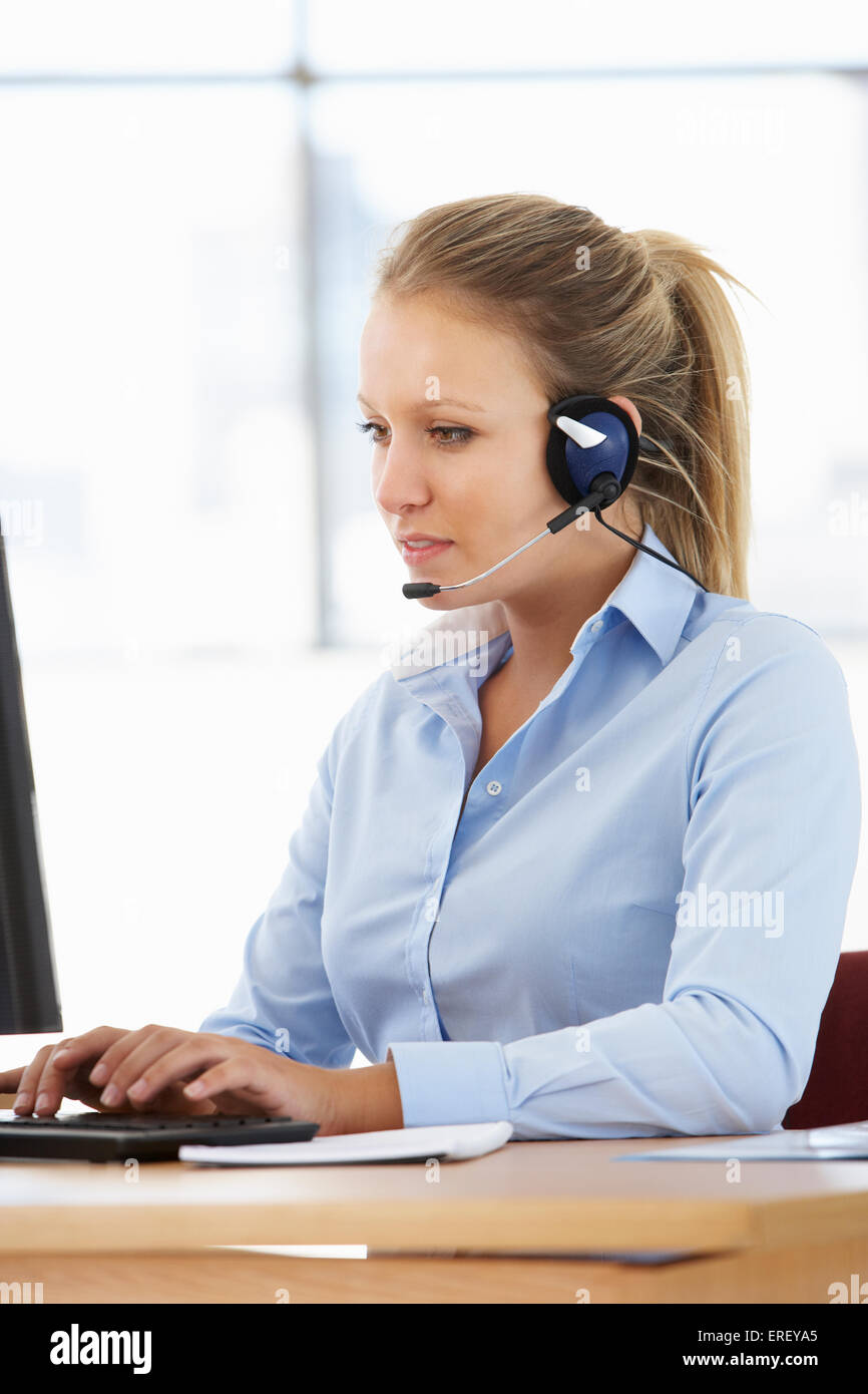 Friendly Service Agent Talking To Customer In Call Centre Stock Photo ...