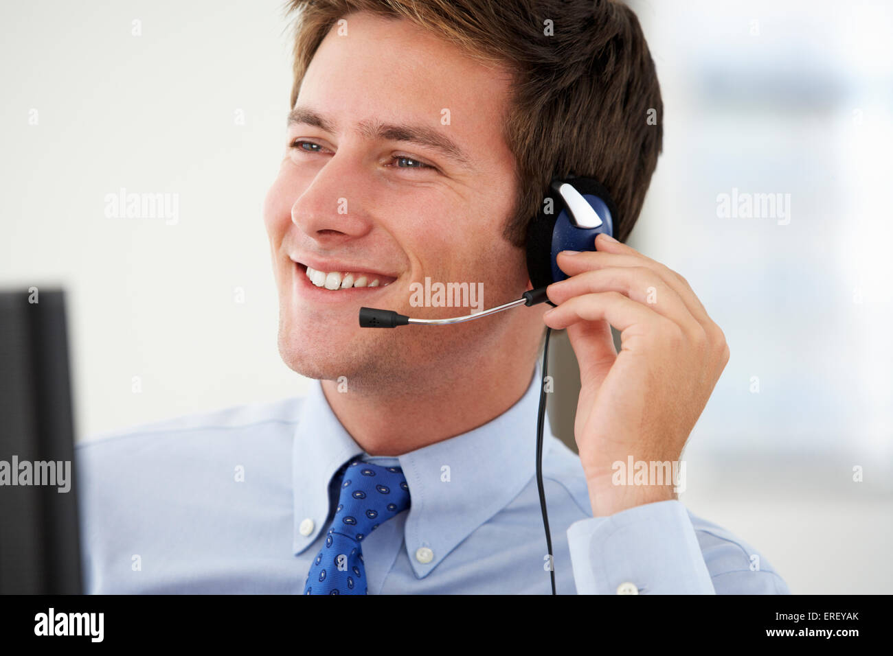 Friendly Service Agent Talking To Customer In Call Centre Stock Photo ...