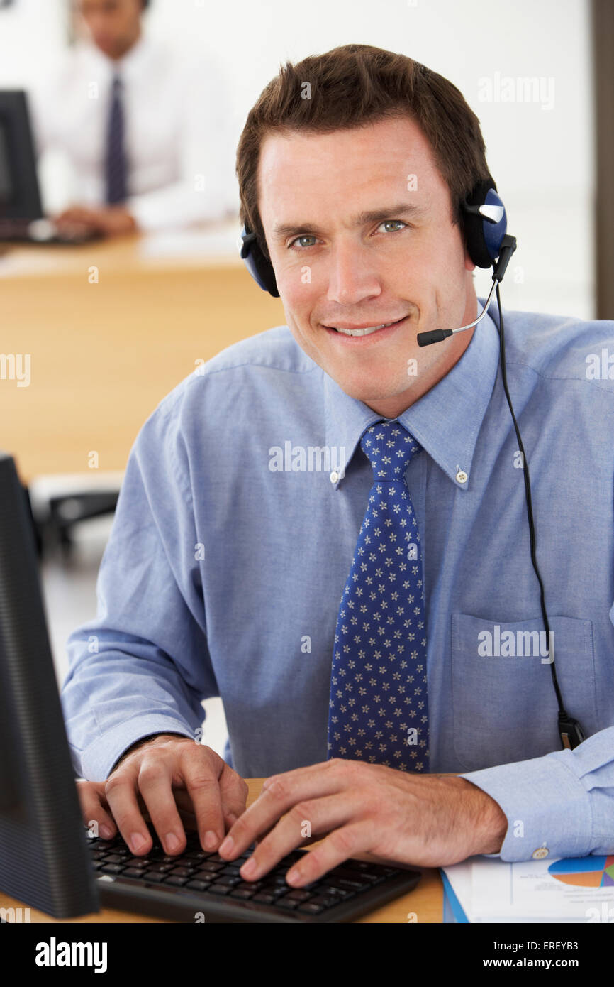Friendly Service Agent Talking To Customer In Call Centre Stock Photo ...
