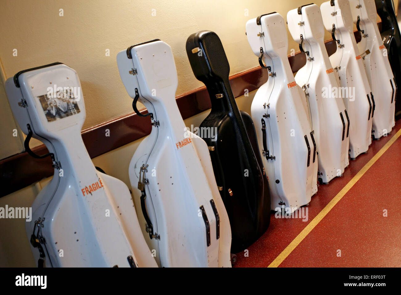 Line of cello cases, flight cases for musical instruments Stock Photo ...