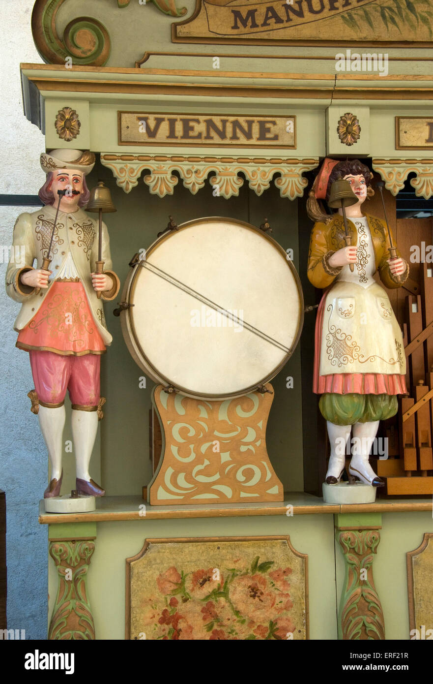 Detail of colourful animated figures on a large barrel organ pictured ...