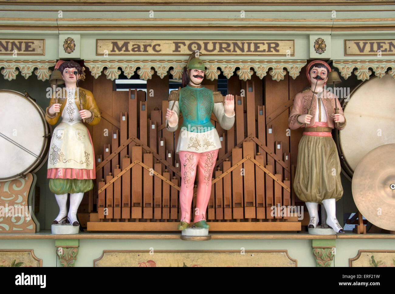 Detail of colourful animated figures on a large barrel organ pictured ...
