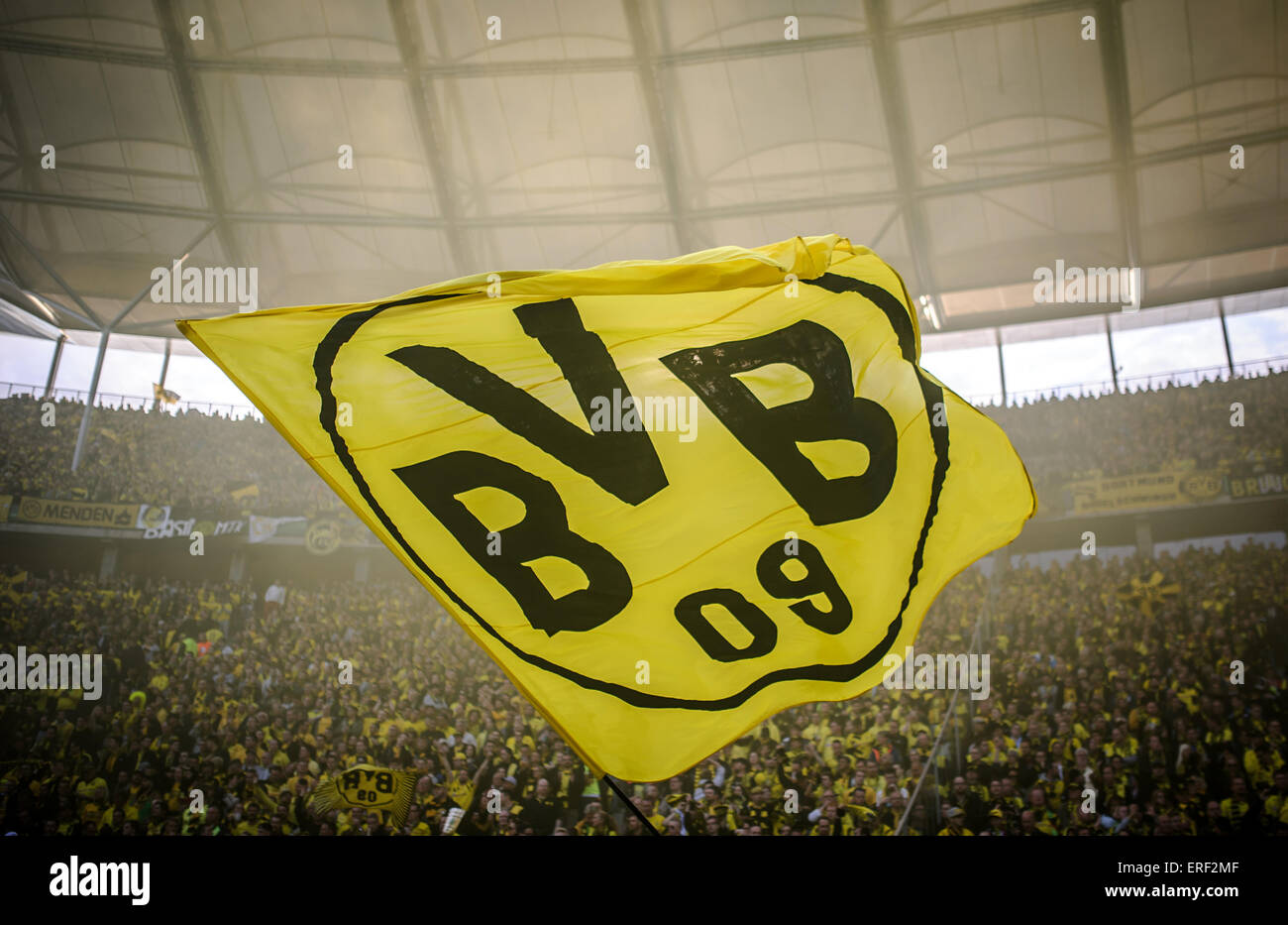 Smoke from flares, lit by Dortmund fans, engulfs the stadium during the ...
