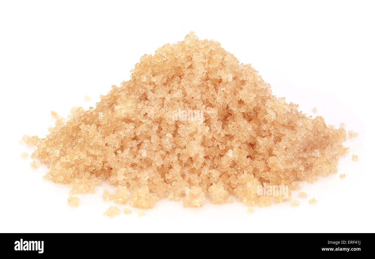 Coarse crystals of brown sugar over white background Stock Photo - Alamy