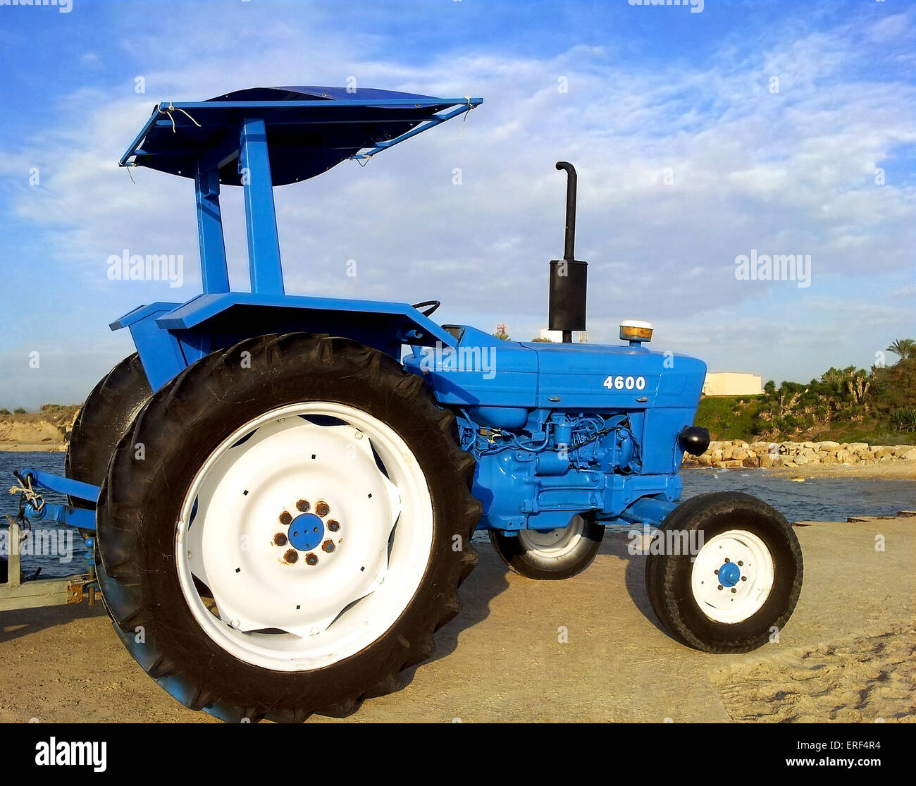 Blue farming tractor truck engine on the beach Stock Photo - Alamy