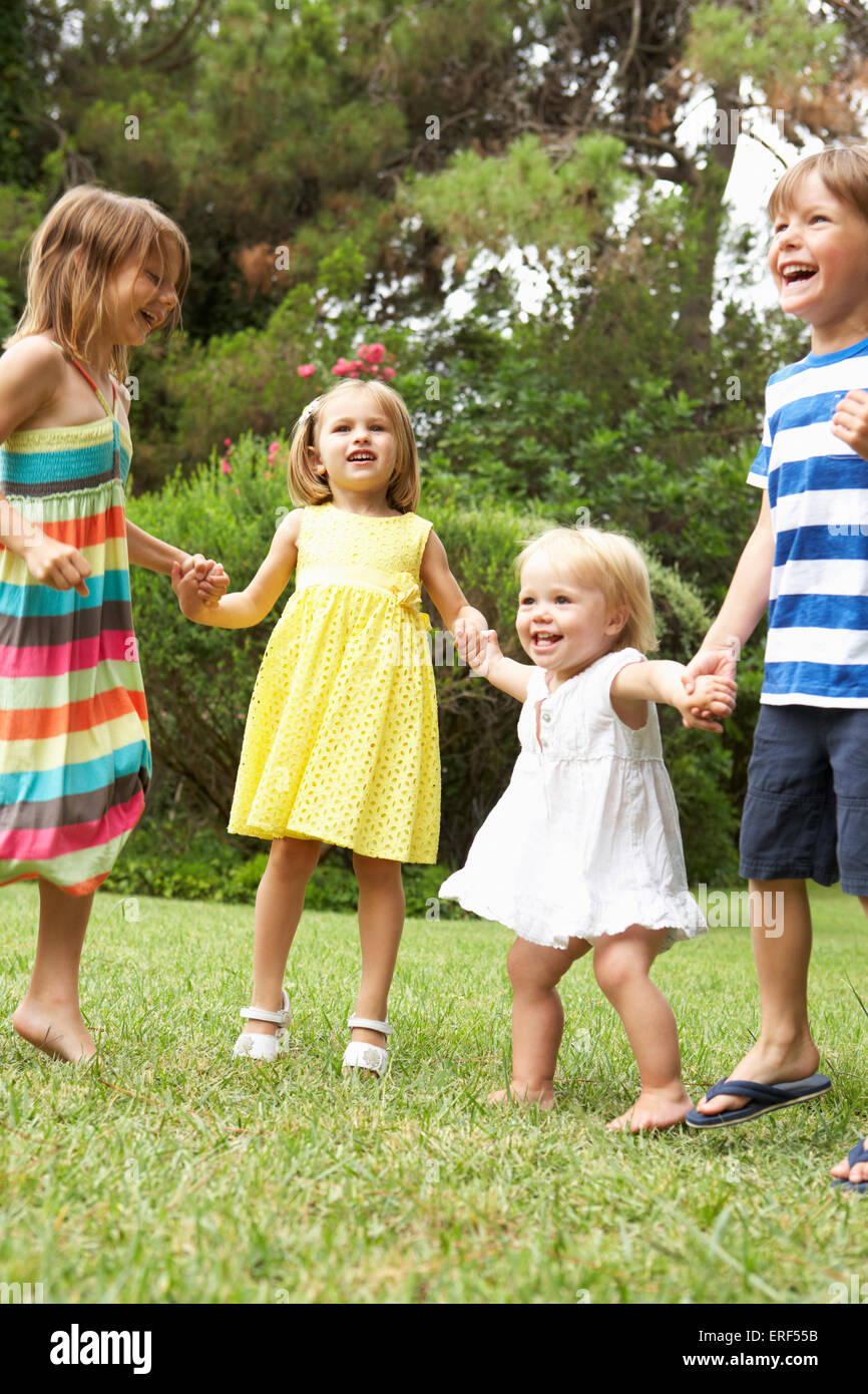 Group Of Children Playing Outdoors Together Stock Photo - Alamy