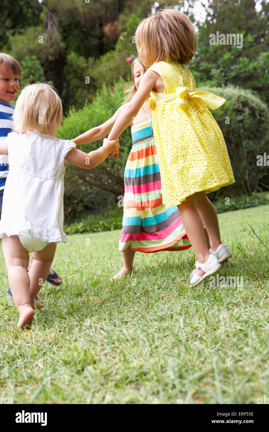 Group Of Children Playing Outdoors Together Stock Photo - Alamy