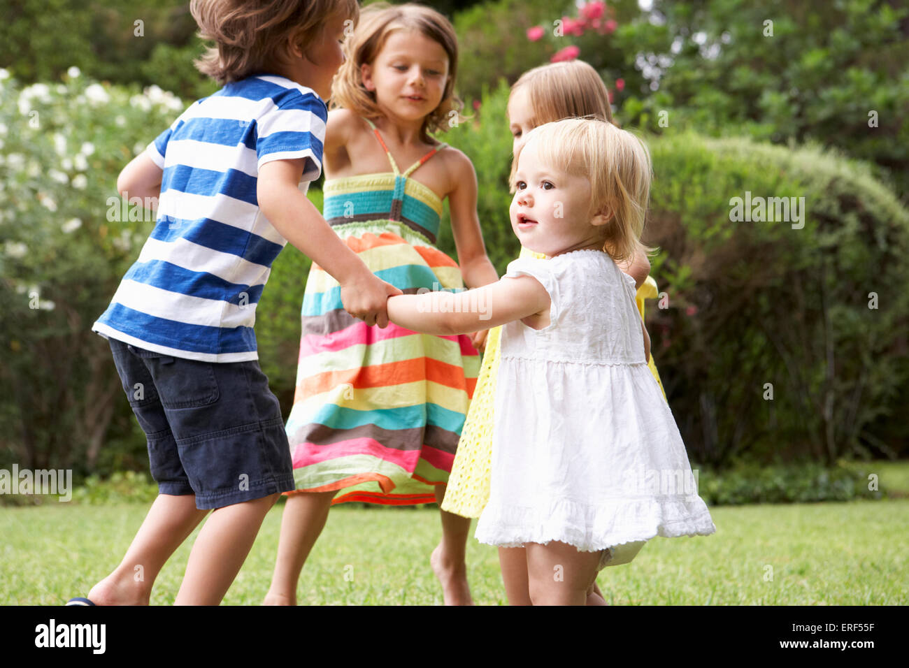 Group Of Children Playing Outdoors Together Stock Photo - Alamy