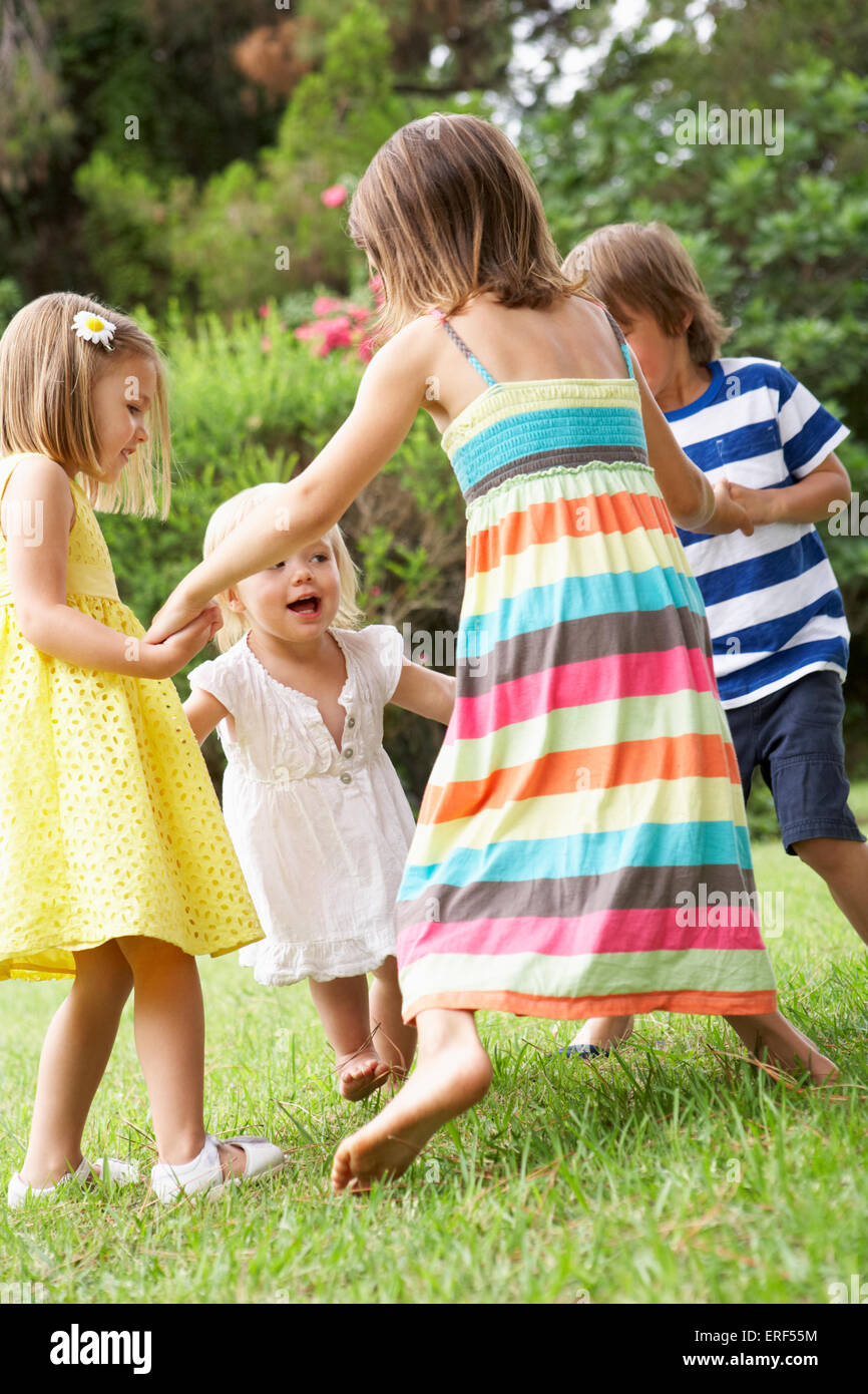 Group Of Children Playing Outdoors Together Stock Photo - Alamy
