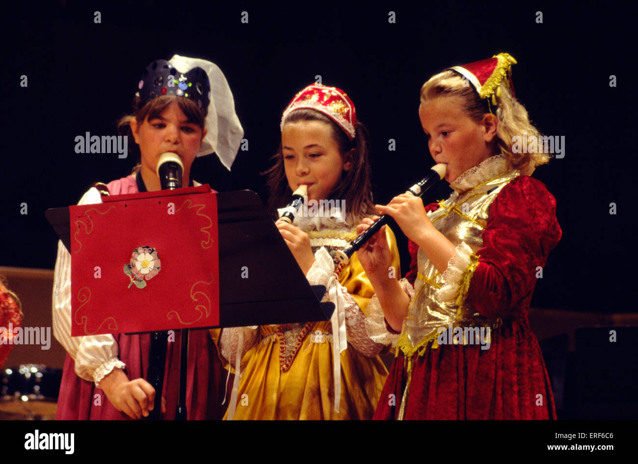 Children playing recorders dressed in costume Stock Photo - Alamy